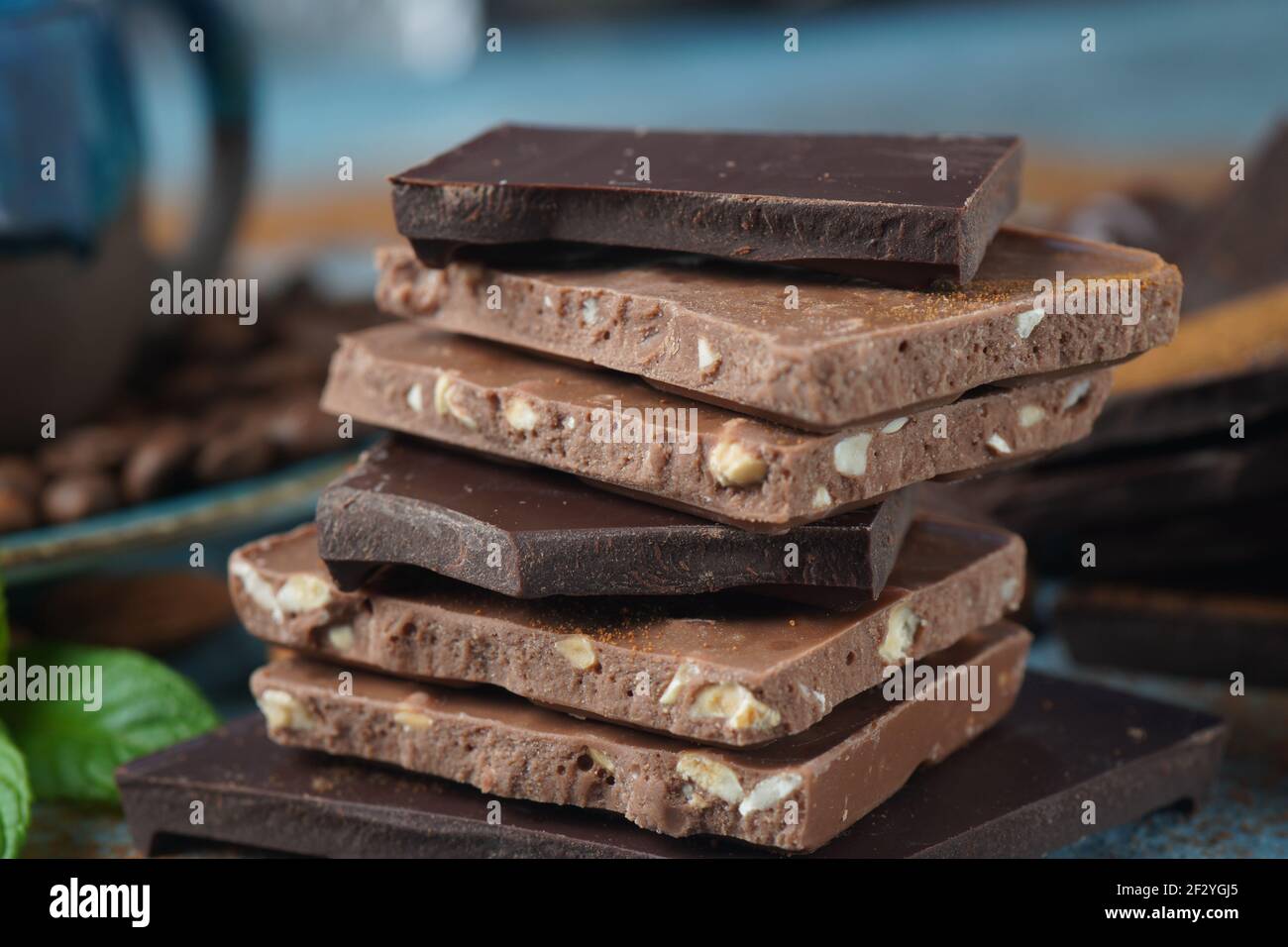 Chocolate tower. Stack of chocolate pieces. The chunks of broken ...