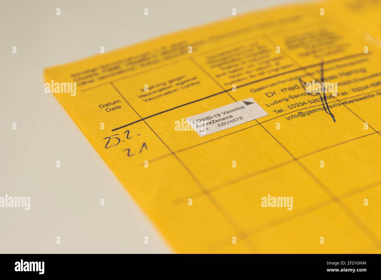 Yellow vaccination book with information about Covid-19 vaccination ...