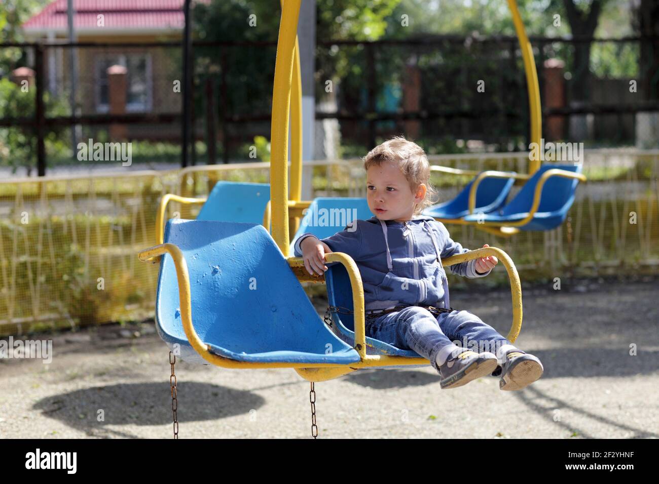 Boy riding a carousel hi-res stock photography and images - Alamy