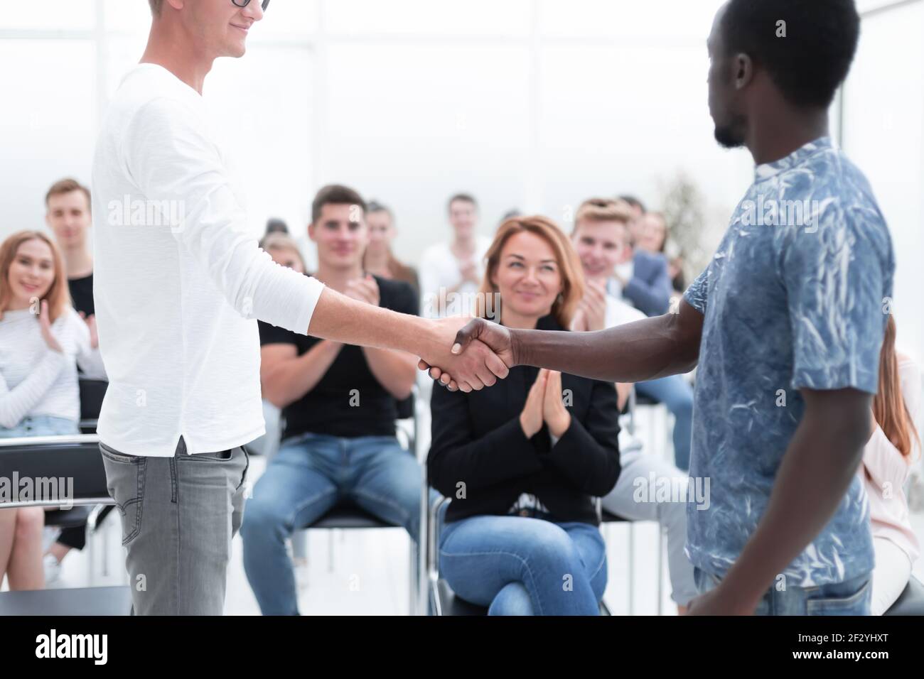 Group shake hands speaker hi-res stock photography and images - Alamy