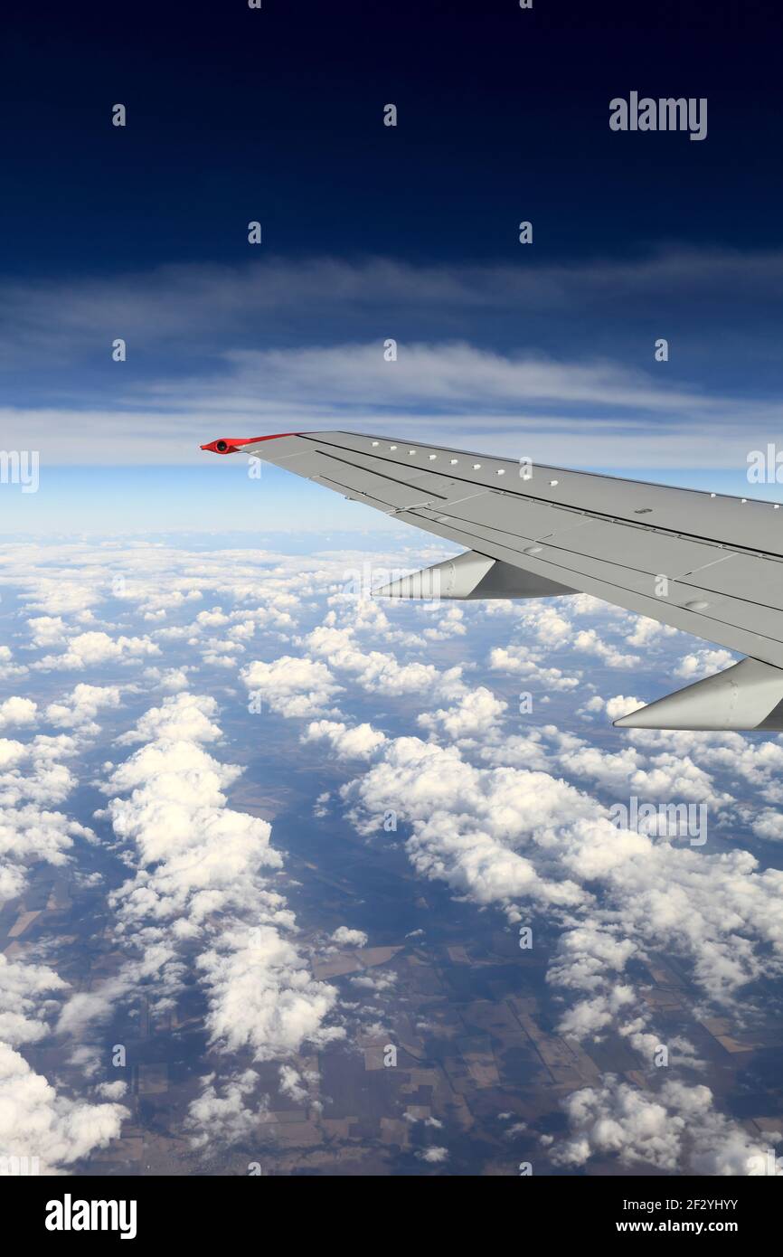 Details of wing aircraft on the sky background Stock Photo - Alamy