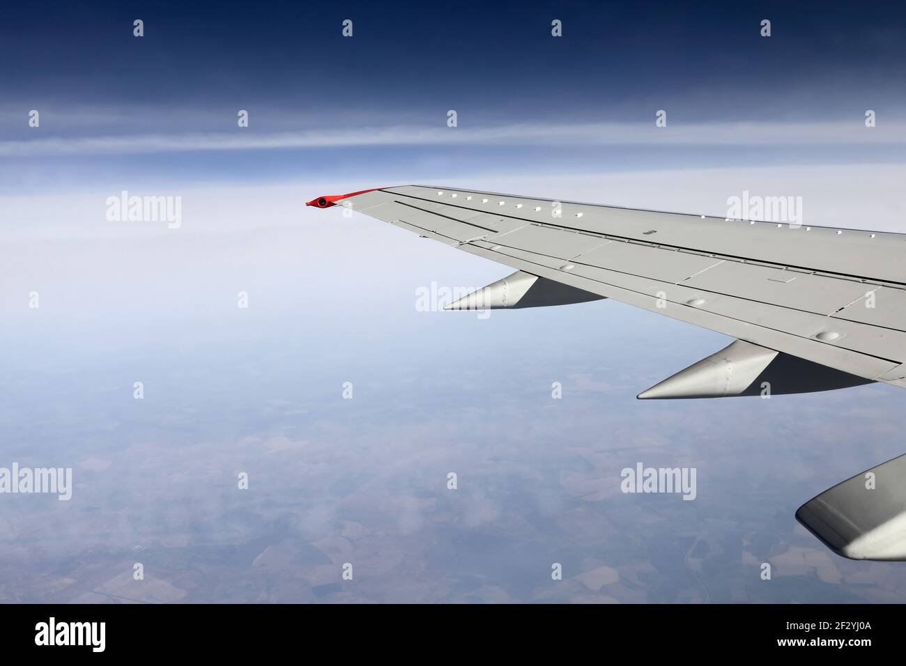 The wing aircraft on the sky background Stock Photo - Alamy
