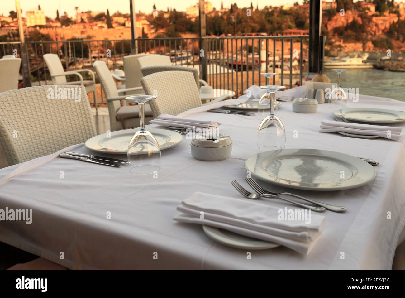 Interior of restaurant on a cliff at sunset Stock Photo - Alamy