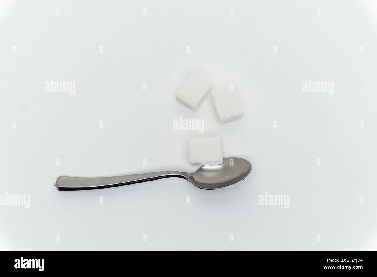 sugar cubes per teaspoon calories sweets light background Stock Photo ...