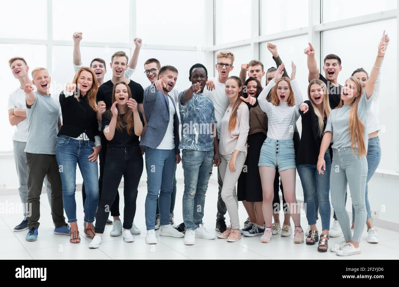 team of happy young people standing together Stock Photo - Alamy