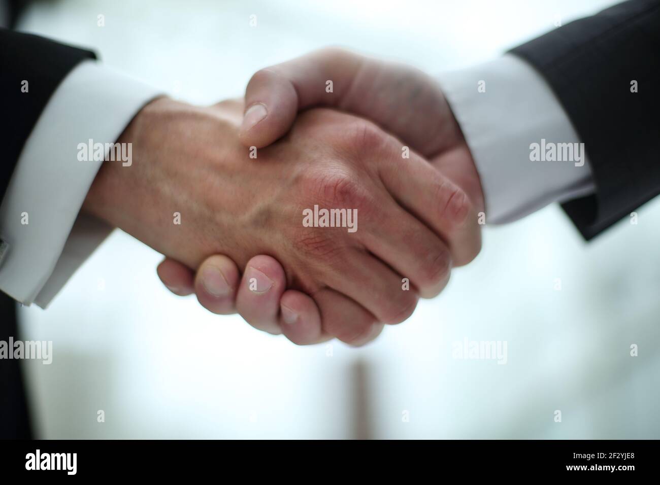 close up. reliable business partners shaking hands Stock Photo - Alamy