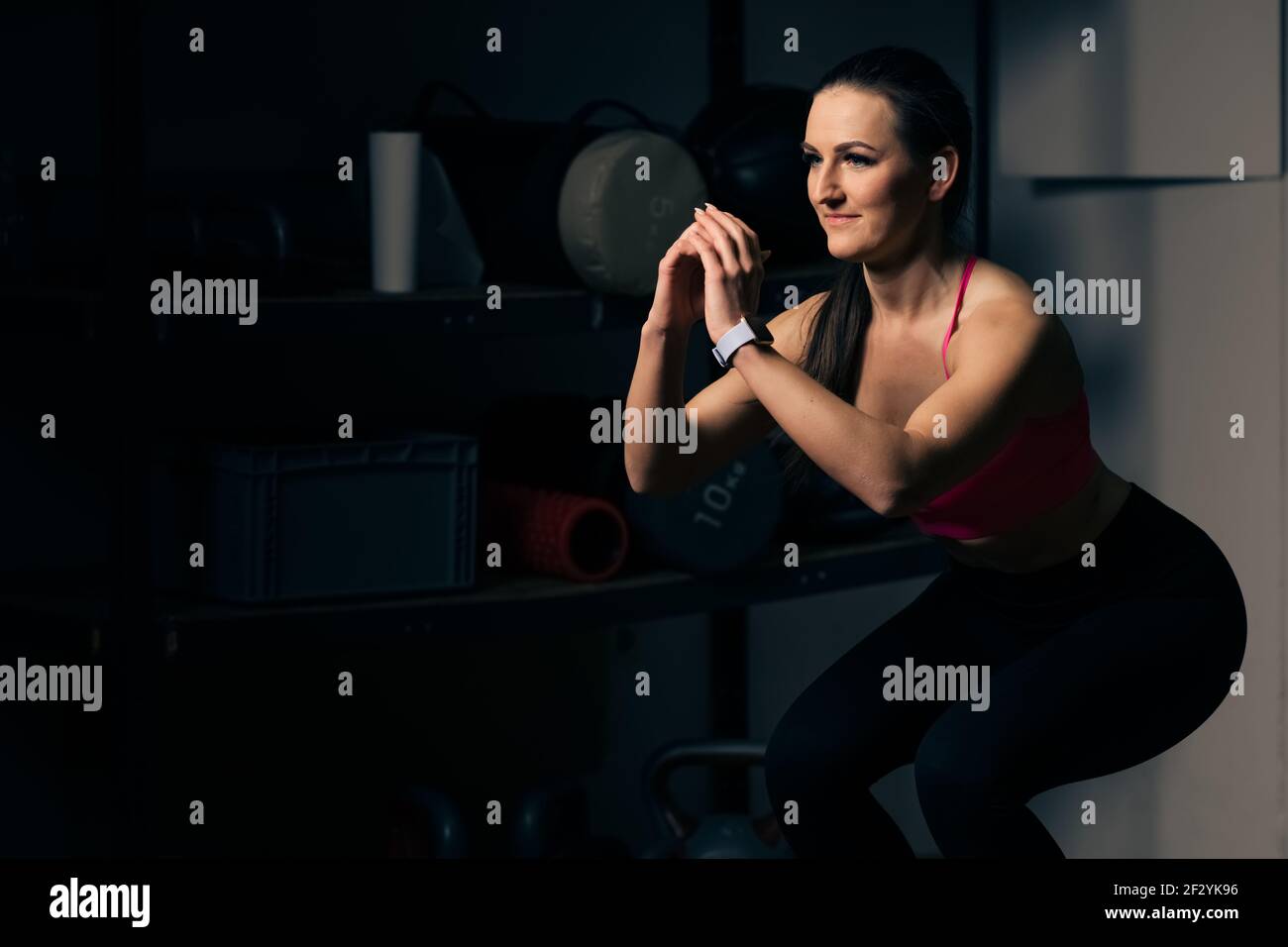 squat on a balance pad during fitness exercises Stock Photo - Alamy