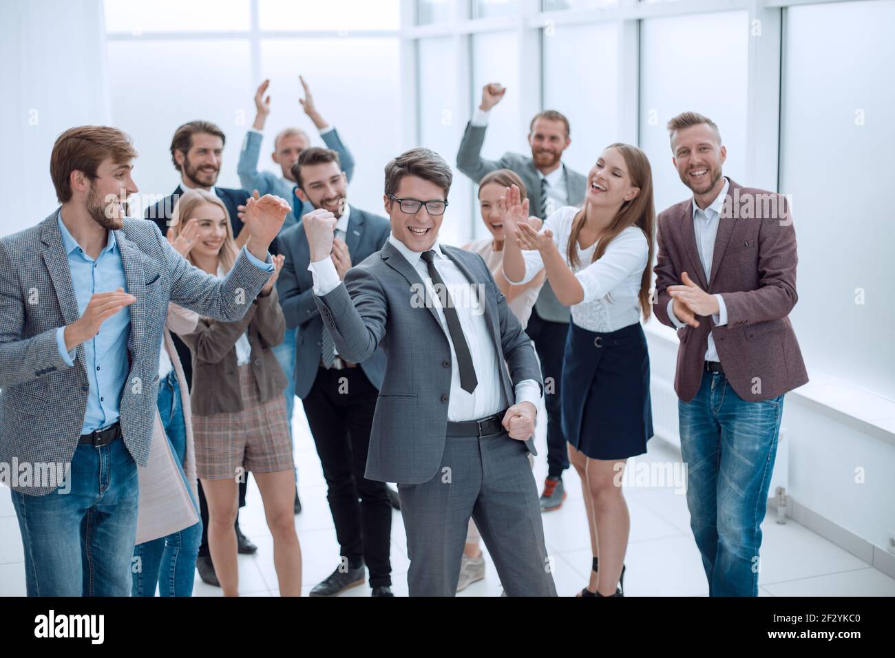 triumphant business team congratulating their leader. success concept ...