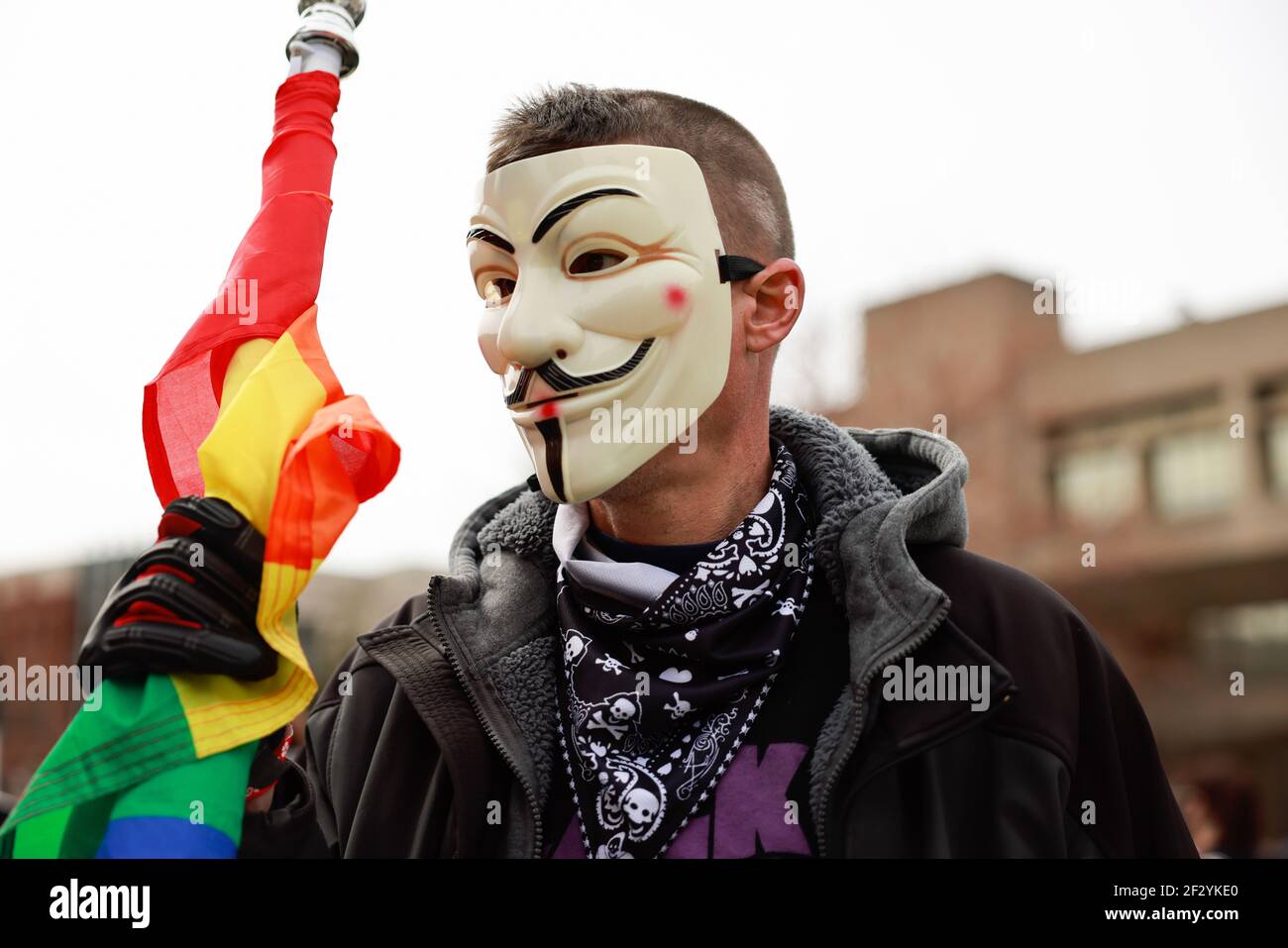 A protester wearing a Guy Fawkes mask for a memorial event at Jefferson ...