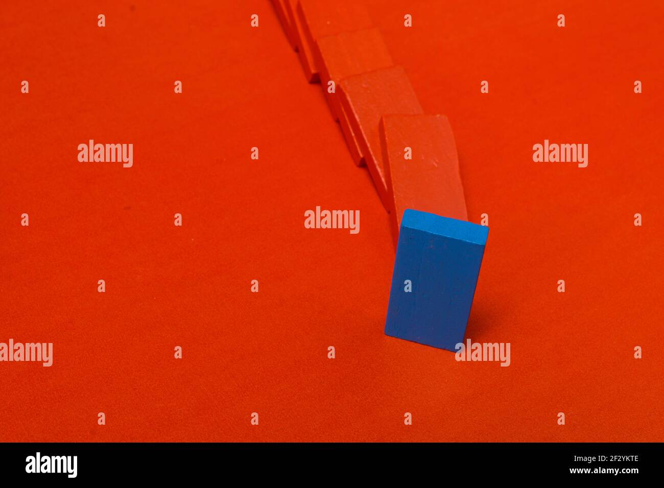 A blue wooden block among red blocks - concept of leaders Stock Photo ...