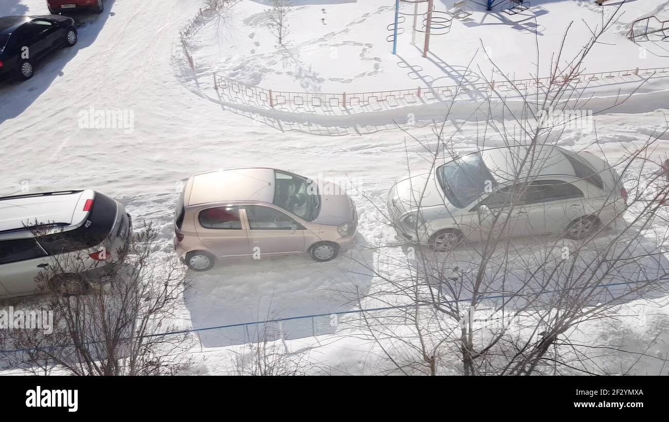 view from the window of a multi-storey building on a parking lot ...
