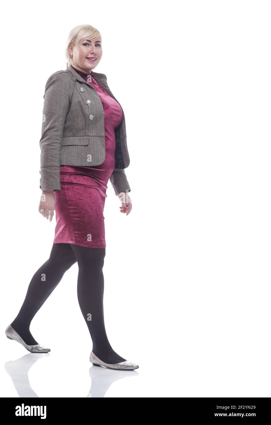 casual young woman stepping forward . isolated on a white Stock Photo ...