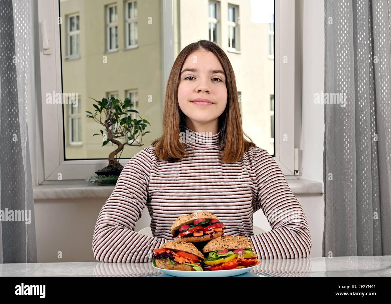 Teen eating veggie meal hi-res stock photography and images - Alamy