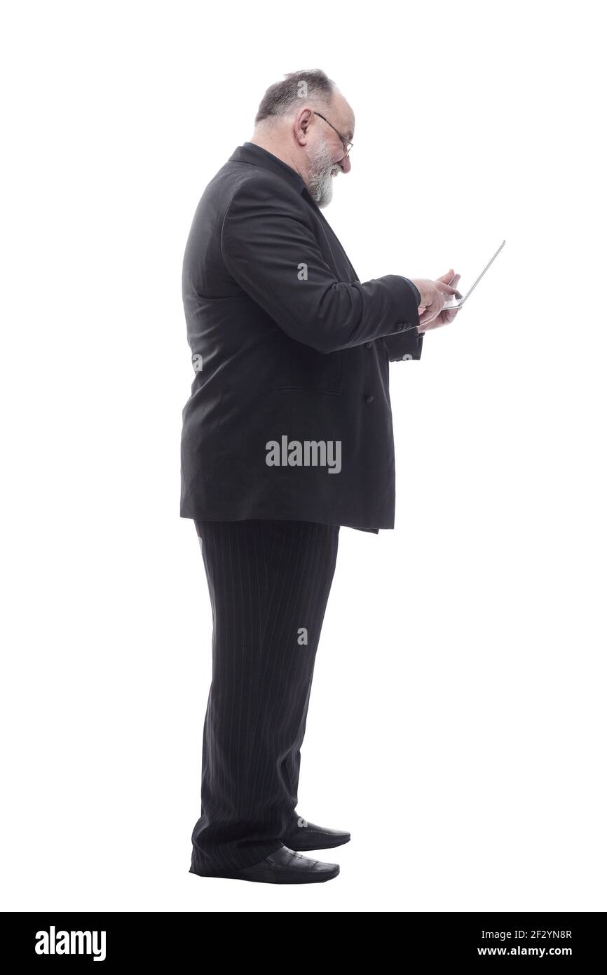 Mature businessman typing on a digital tablet . isolated on a white ...