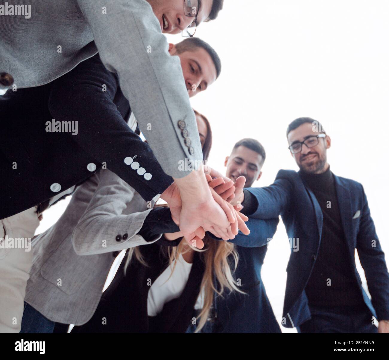 group of young employees showing their unity Stock Photo - Alamy
