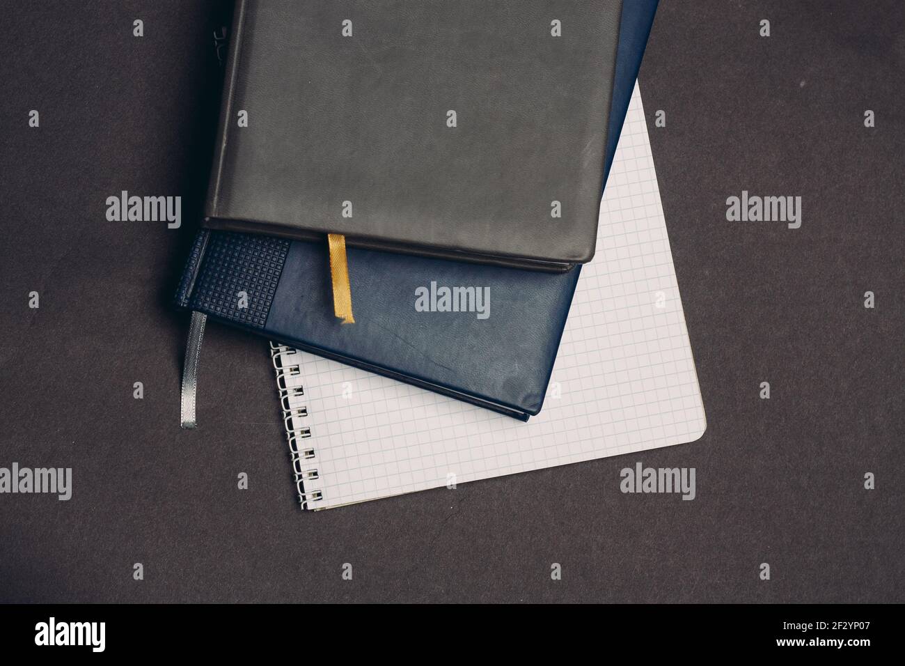 notepads documents books pens desktop gray background Stock Photo - Alamy