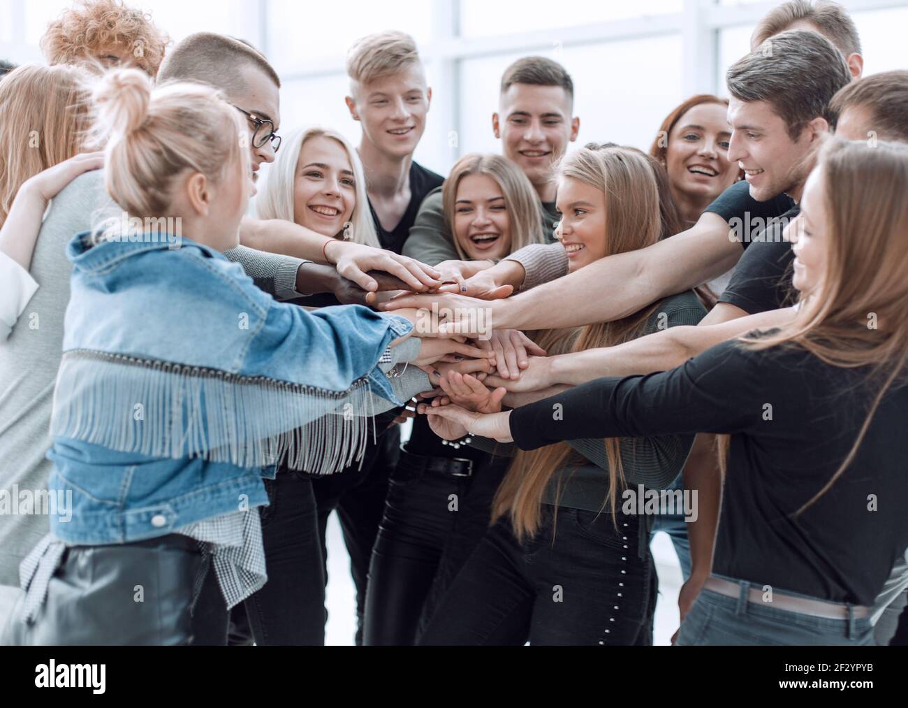 close up. a group of young people showing their unity Stock Photo - Alamy