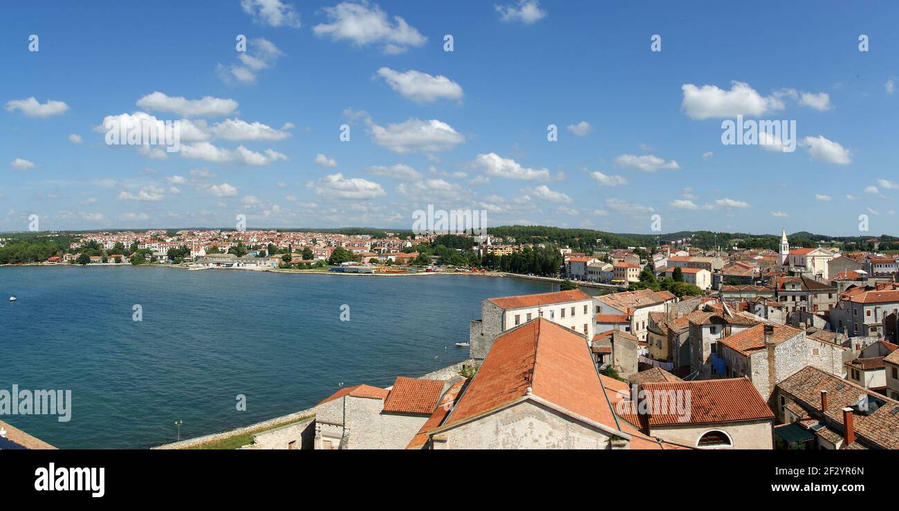 Panoramic landscape with the sky, the sea and rooftops, Porec, Croatia ...