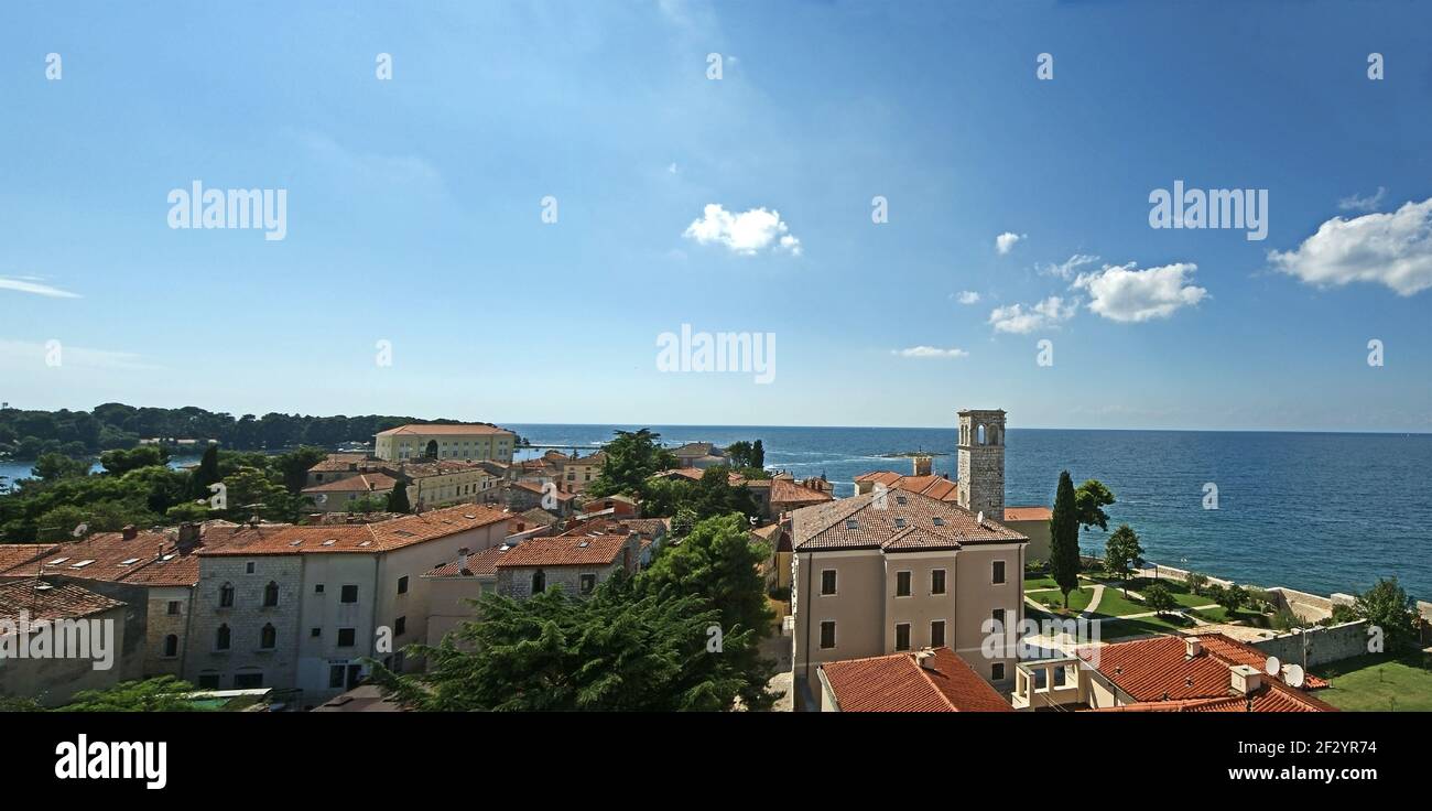 Panoramic landscape with the sky, the sea and rooftops, Porec, Croatia ...