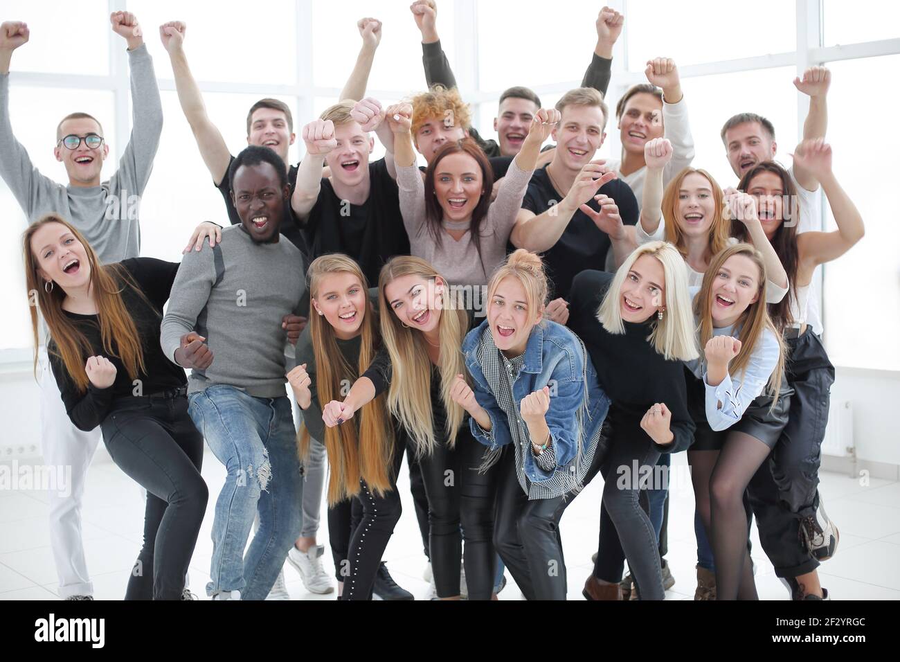close up. a jubilant group of cheerful young people Stock Photo - Alamy