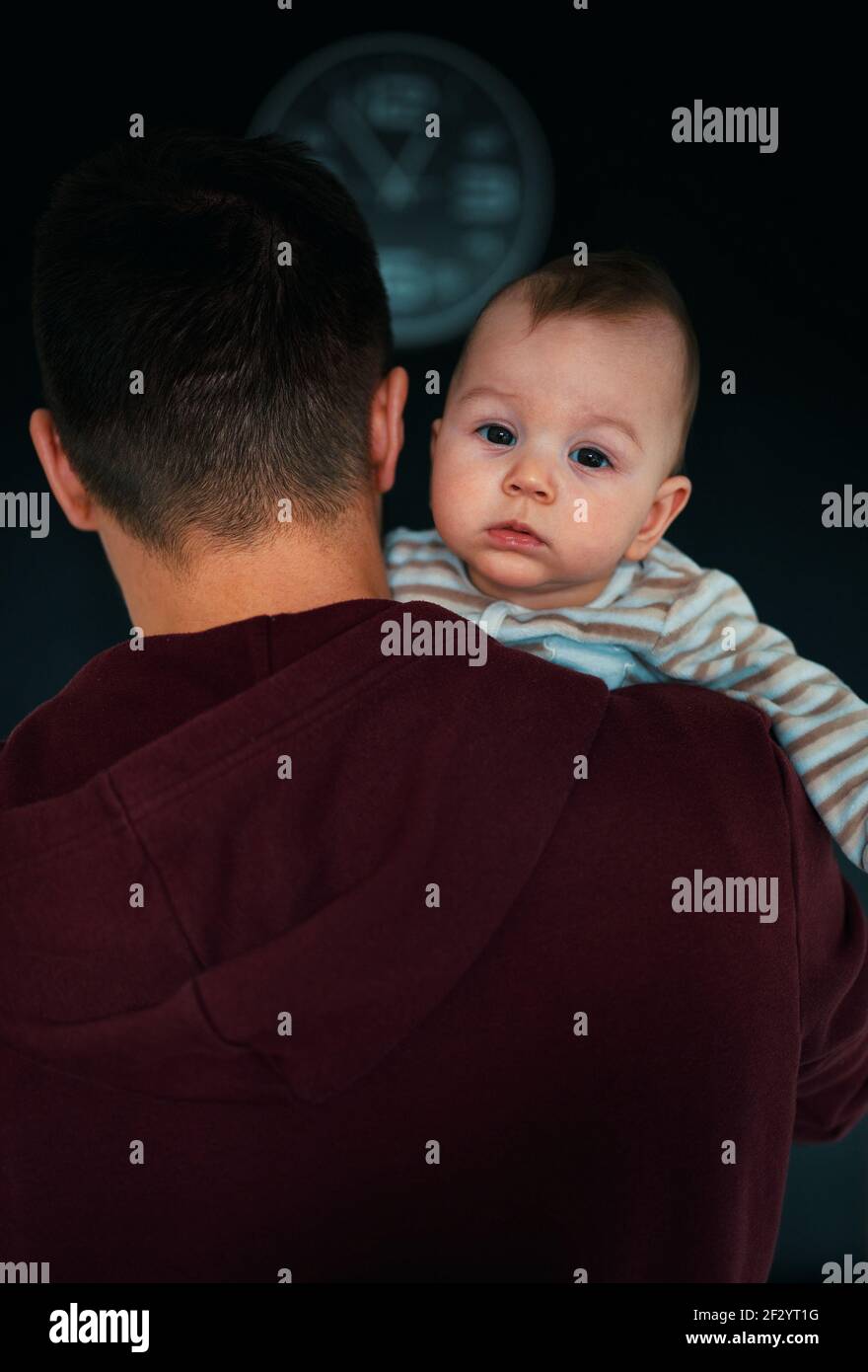 Father carrying his little baby who can't sleep at about 1 AM Stock ...