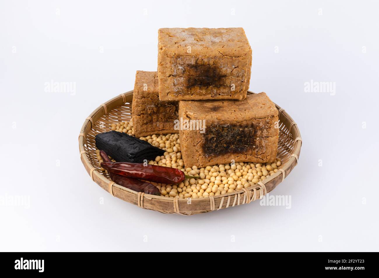 Meju, beans, dried chilli, charcoal set and white background. Korean ...