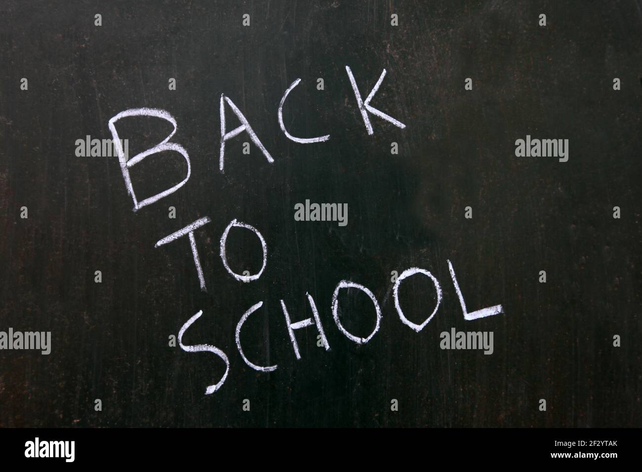 back to school written on a chalk board Stock Photo - Alamy