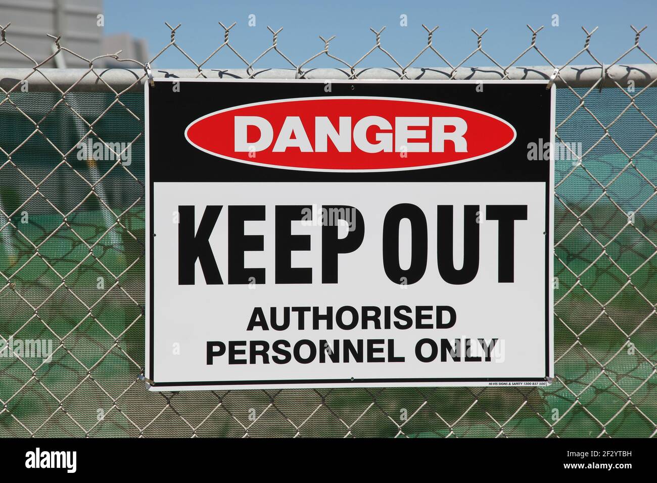 Danger keep out sign on a chain wire fence Stock Photo - Alamy