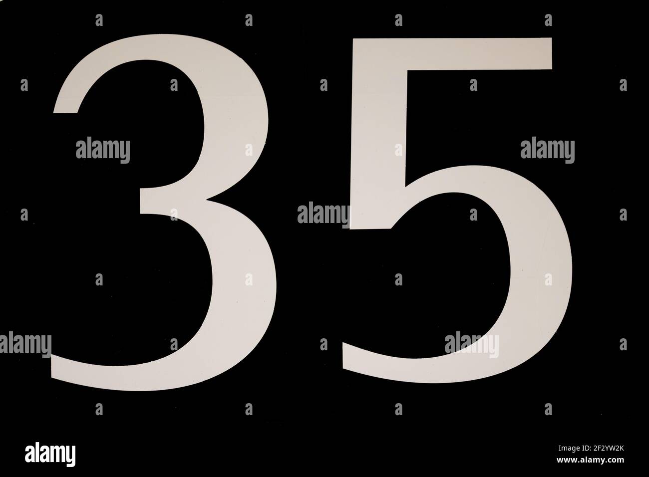 High contrast black and white sign with the stencilled number thirty ...