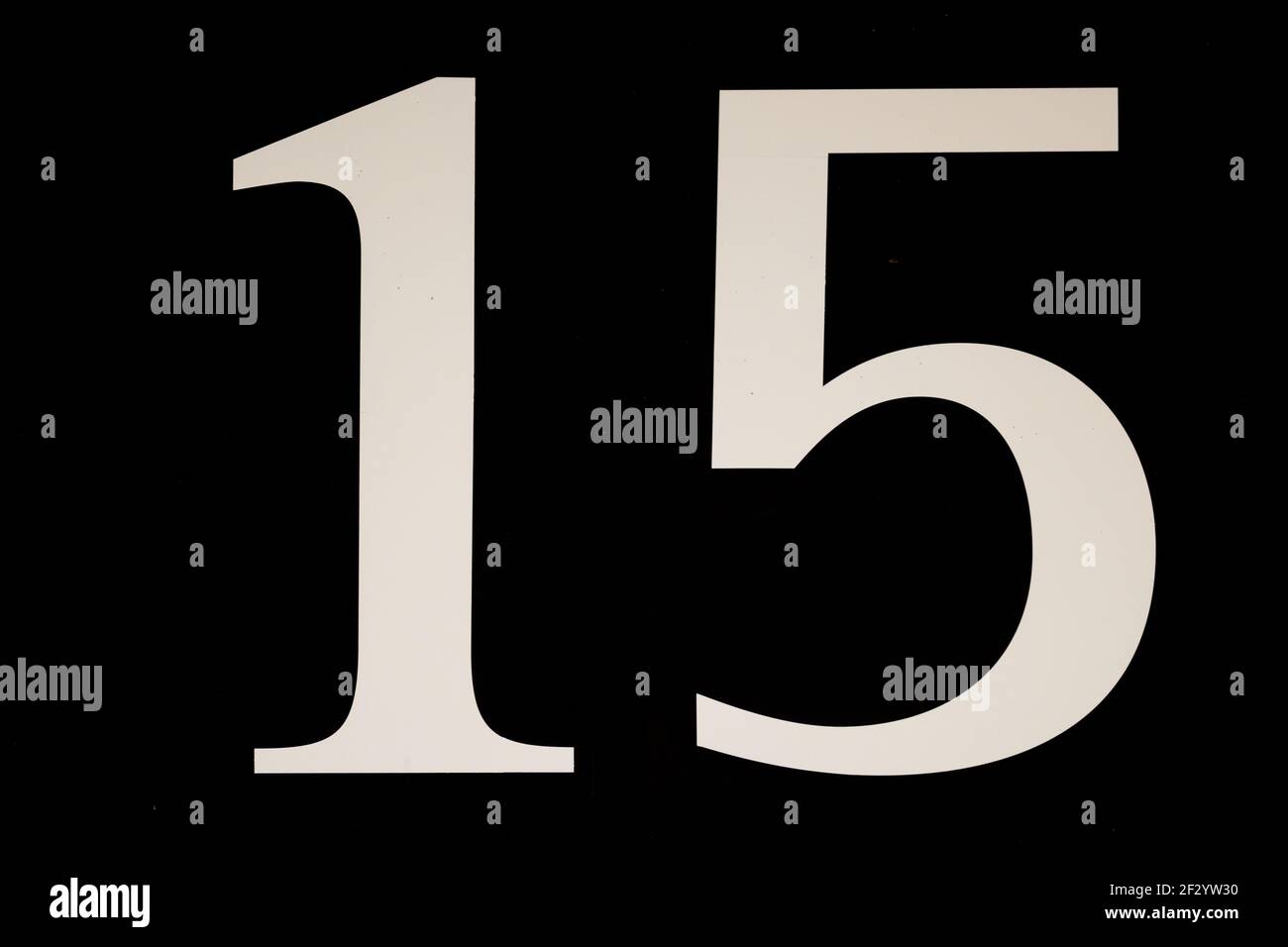 High contrast black and white sign with the stencilled number fifteen ...