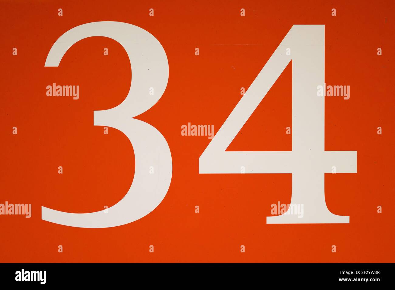 Colorful red and white sign with the number thirty-four - 34 ...