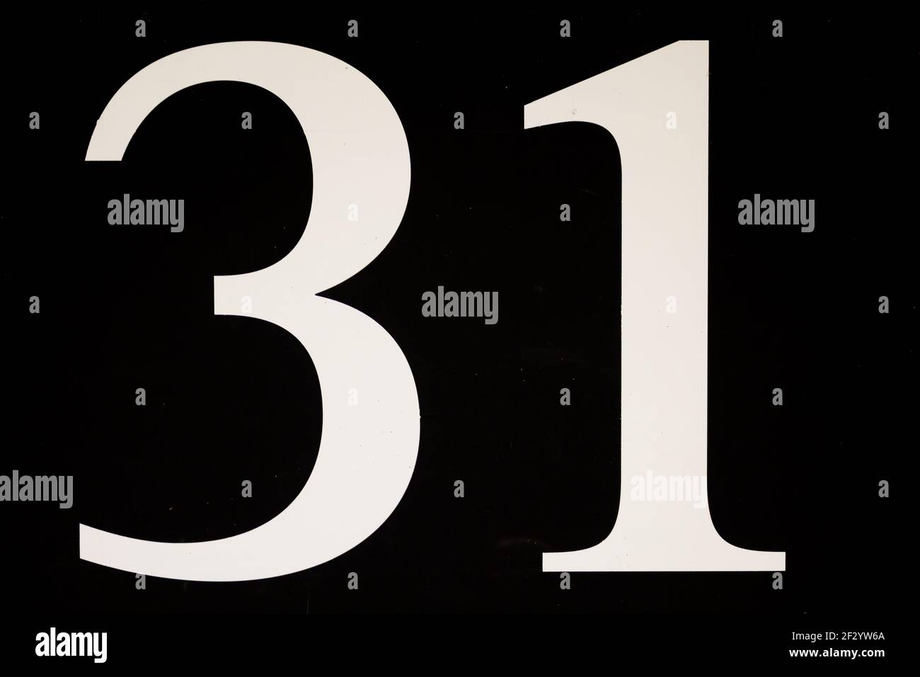 High contrast black and white sign with the stencilled number twenty ...