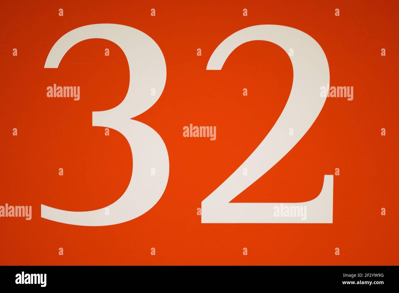 Colorful red and white sign with the number thirty-two - 32 ...