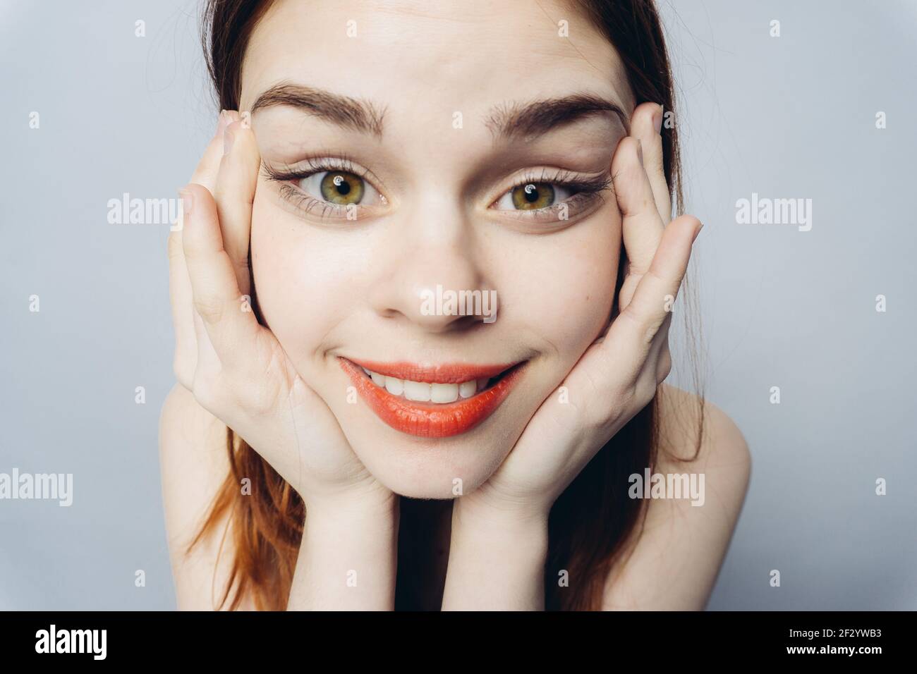 emotional woman holding hands on face emotions antics close-up Stock ...