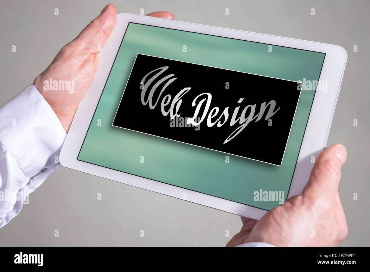 Tablet screen displaying a web design concept Stock Photo - Alamy