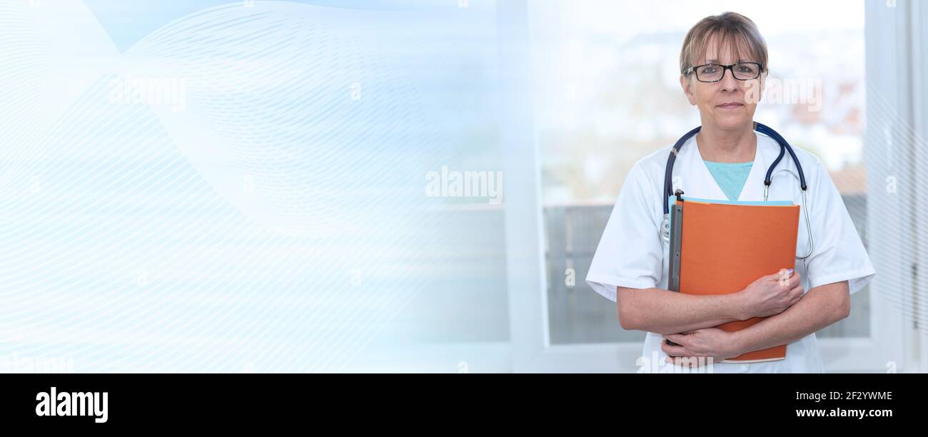 Portrait of female doctor standing and holding a folder; panoramic ...