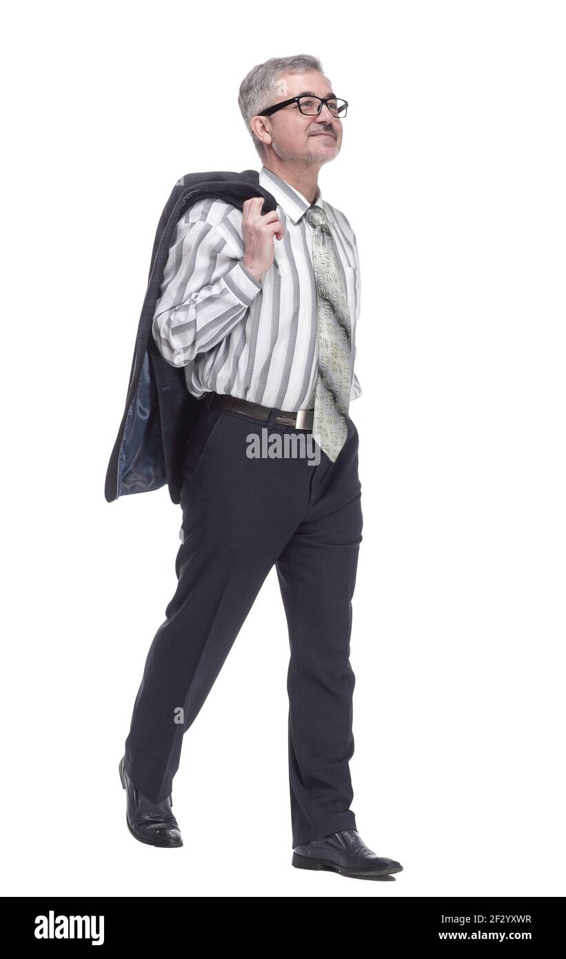 full length . smiling mature man walking with a jacket over his ...