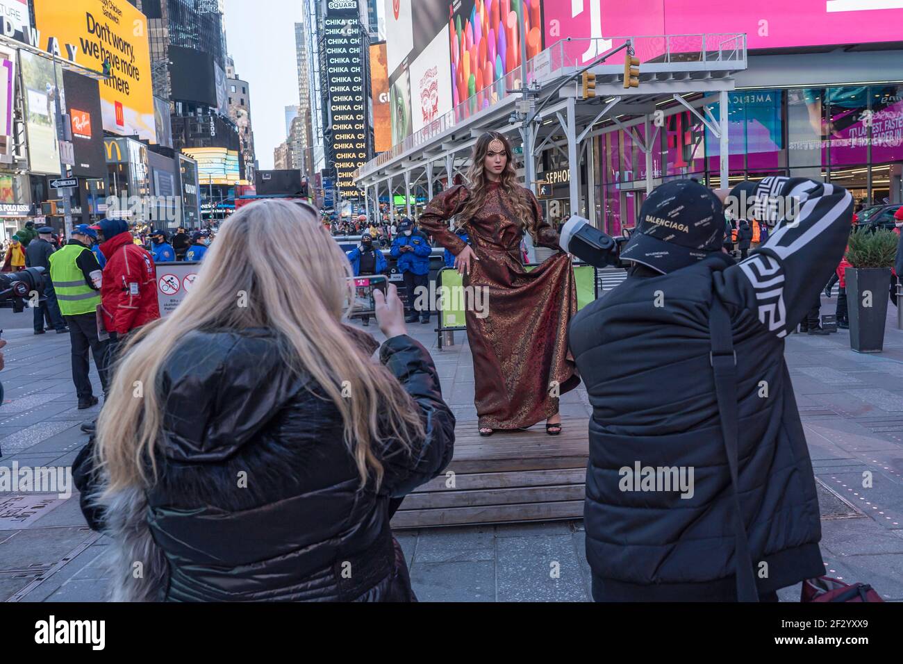 A model poses for a photo during a fashion shoot in Manhattan's Times ...