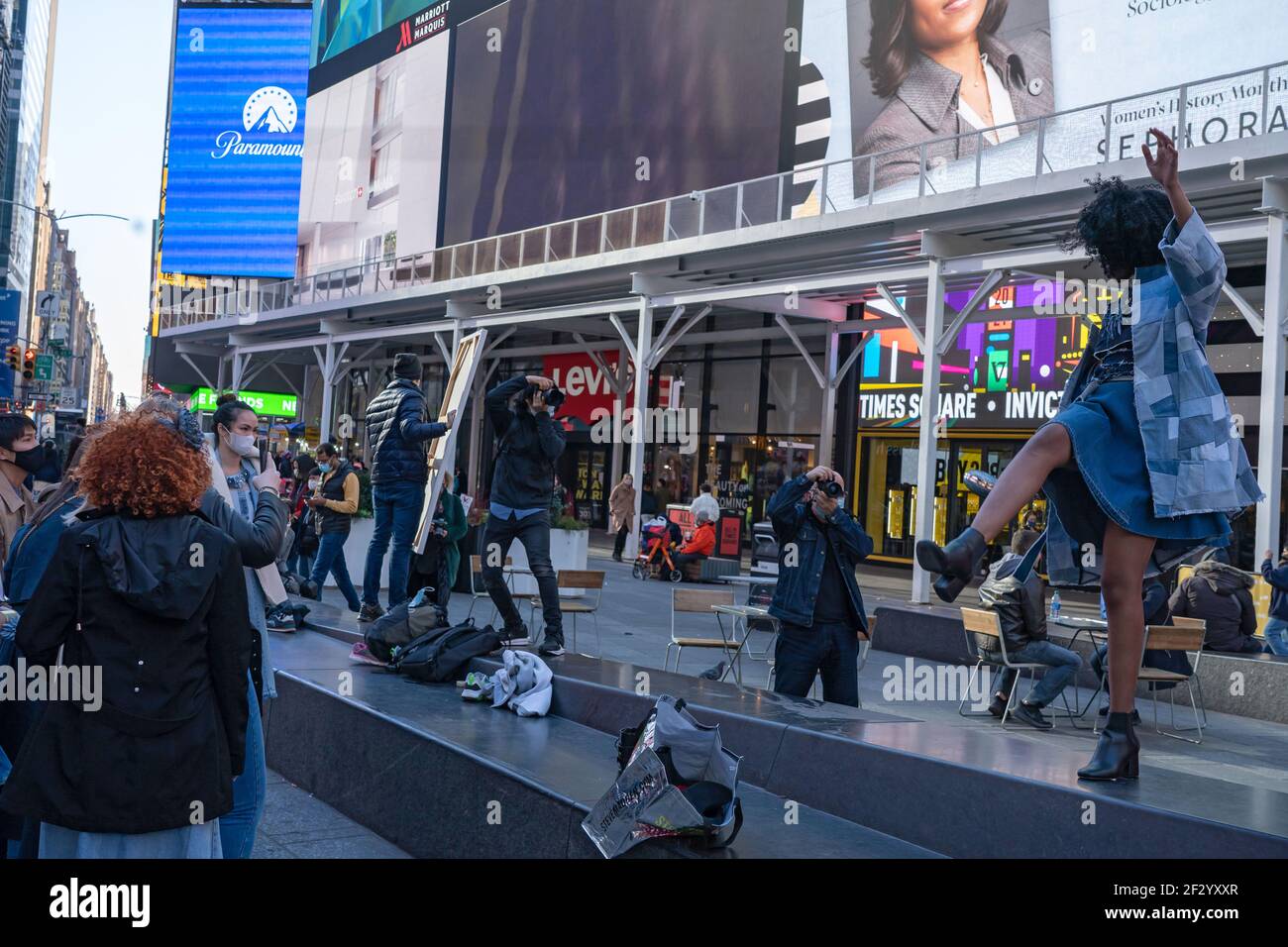 A model poses for a photo during a fashion shoot in Manhattan's Times ...