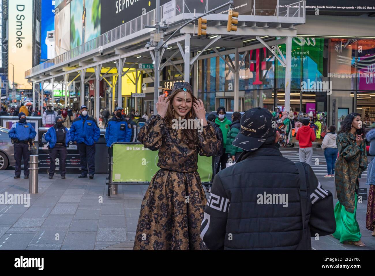 A model poses for a photo during a fashion shoot in Manhattan's Times ...