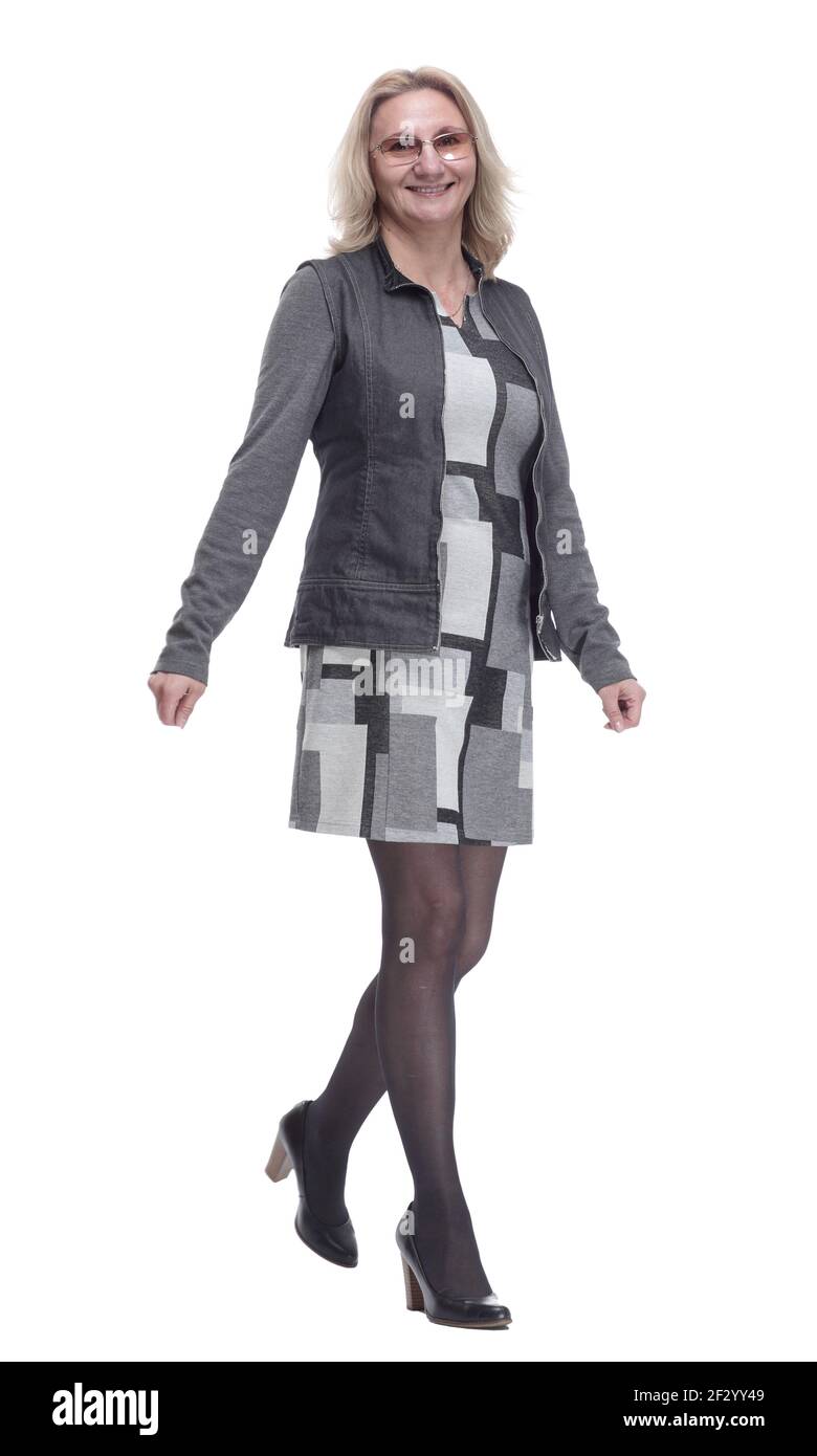 happy young woman striding forward. isolated on a white Stock Photo - Alamy