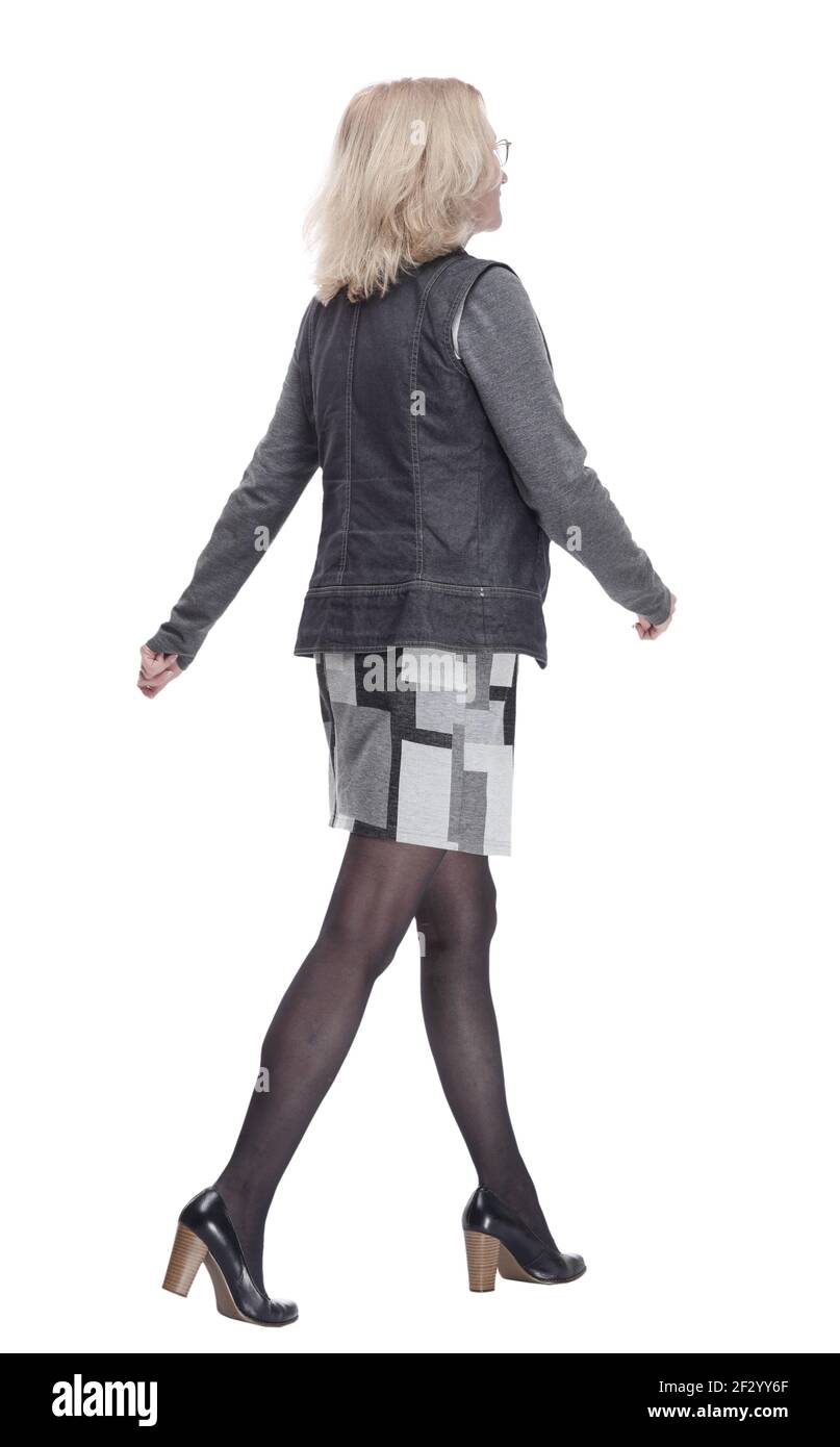 side view. confident young woman striding forward Stock Photo - Alamy