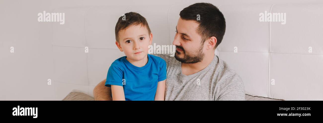 Fathers Day holiday. Middle age Caucasian father talking to boy son ...