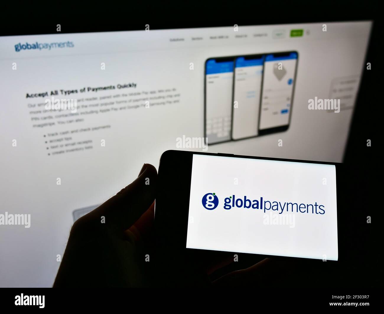 Person holding smartphone with logo of US payment services provider ...