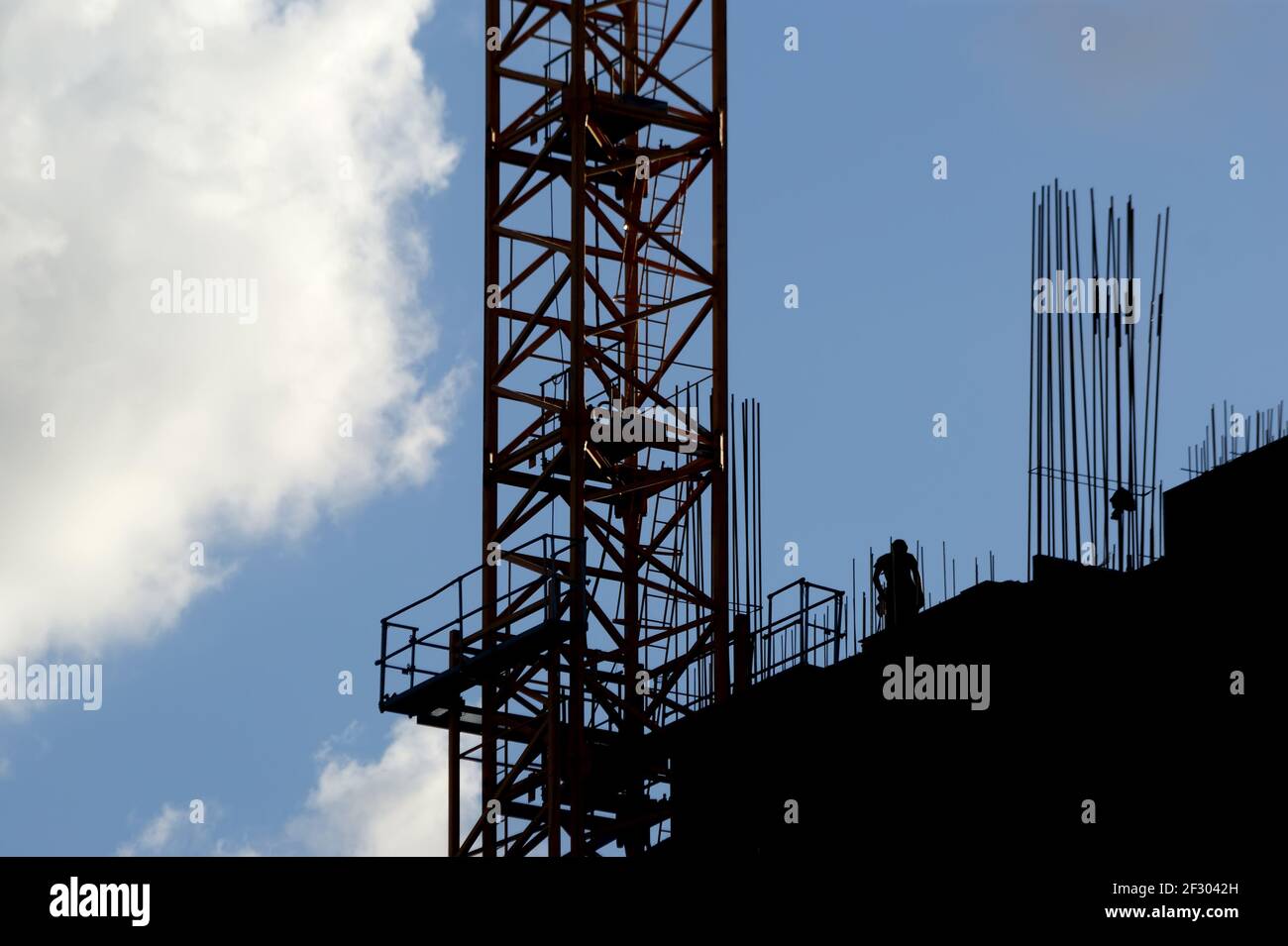 construction equipment and elements of a building under construction ...