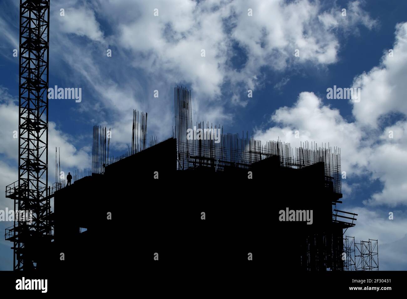 construction equipment and elements of a building under construction ...