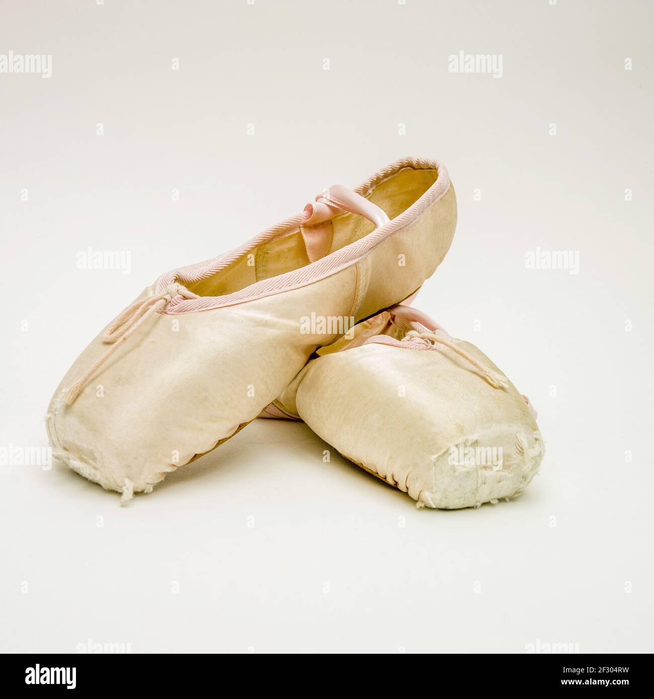 A pair of ballet shoes isolated on white background Stock Photo - Alamy