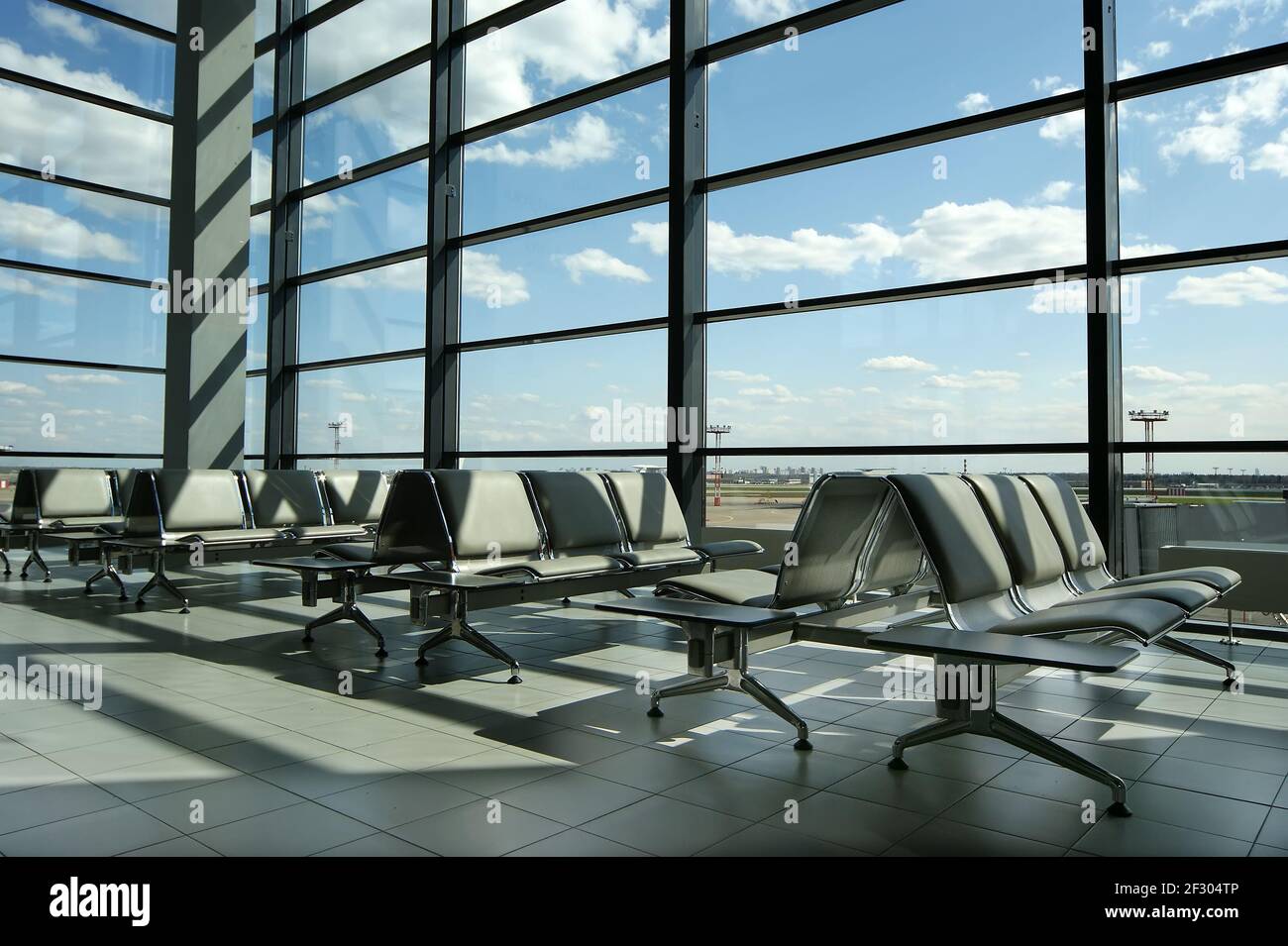 Airport gates, modern architecture of the airport terminal with seats ...