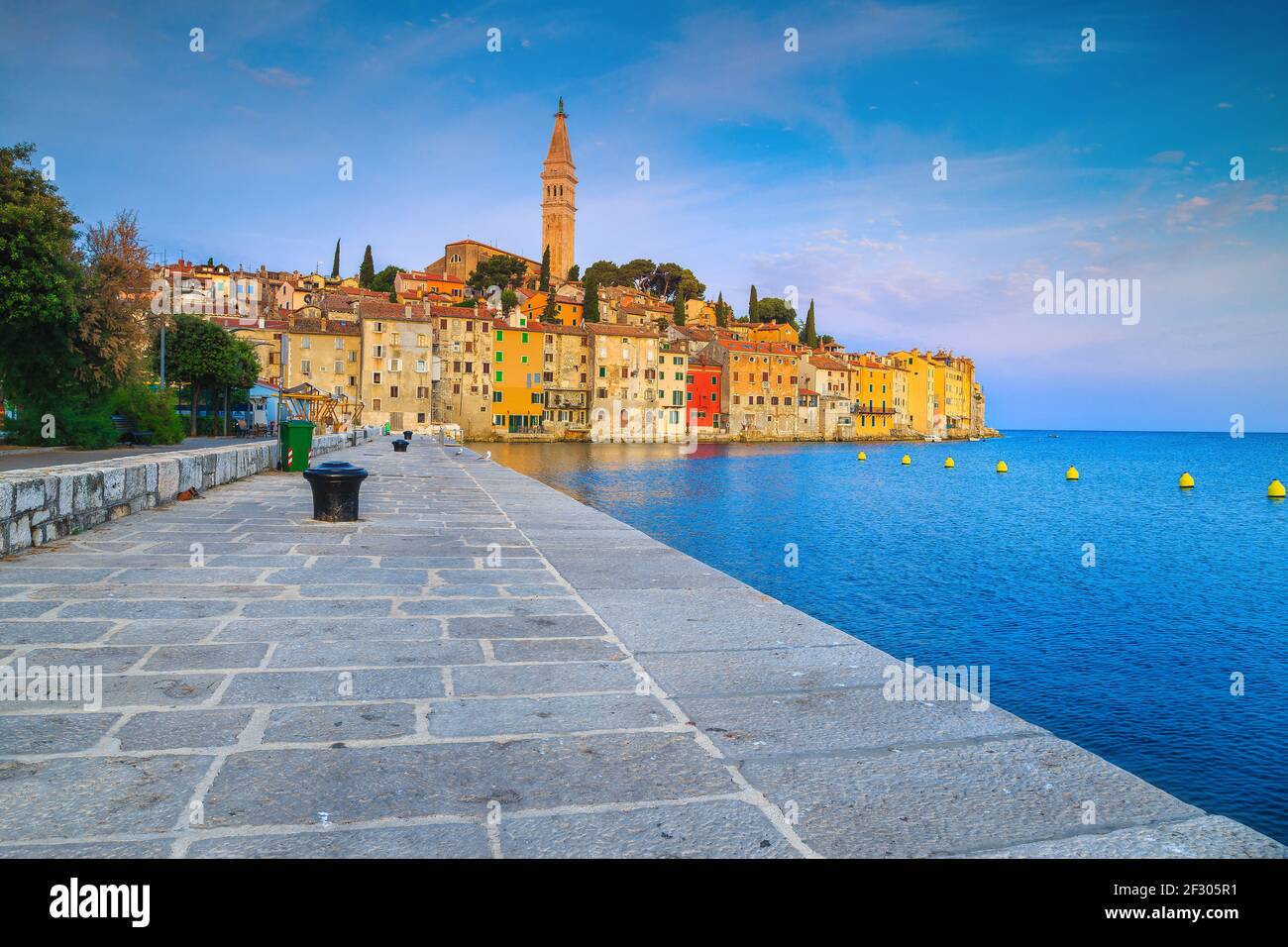 Fantastic waterfront walkway with colorful old buildings on the small ...