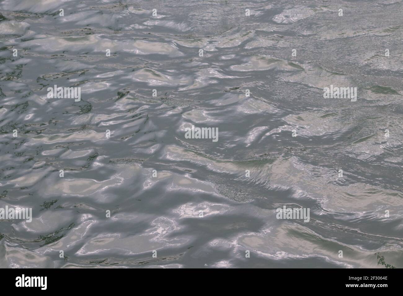 Sea water in harbour in close up Stock Photo - Alamy
